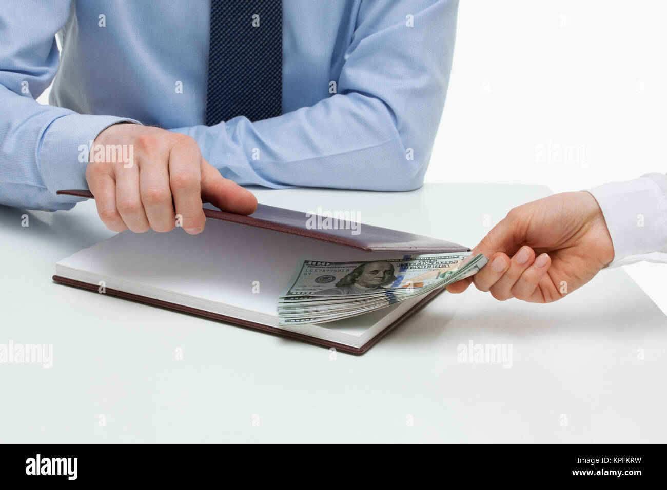 Businessman taking a bribe Stock Photo - Alamy