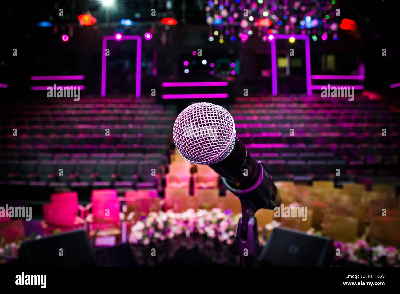 close up microphone against blur colorful light in music studio Stock ...
