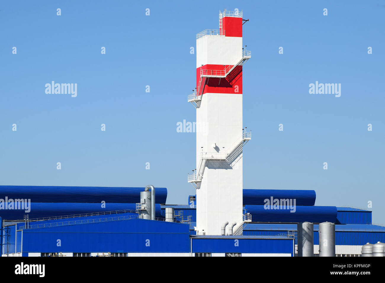 Fire tower at the plant for the processing of scrap metal. Huge factory ...