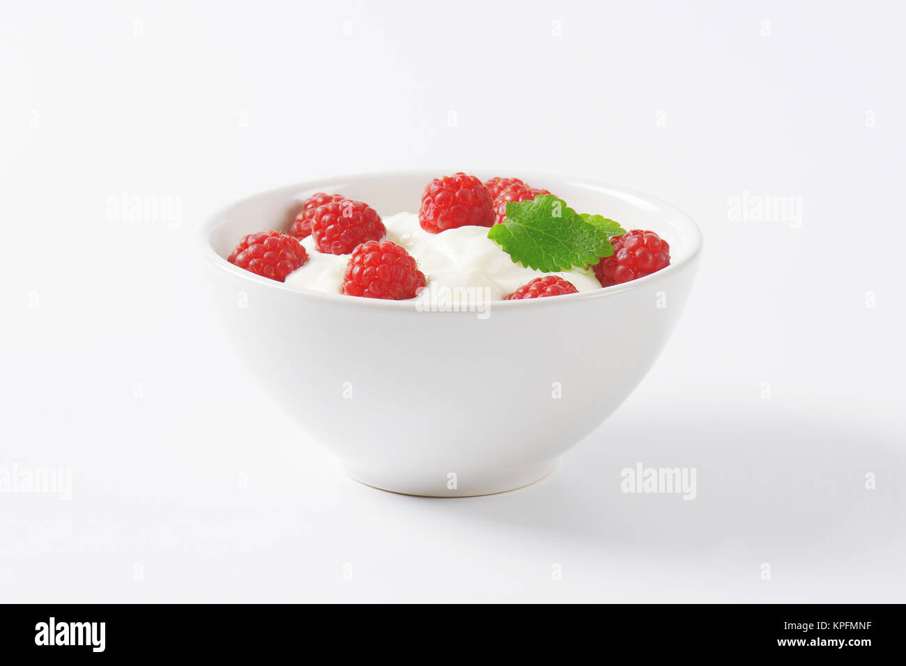 raspberries in yoghurt Stock Photo - Alamy