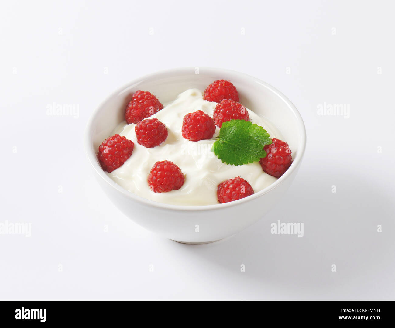 raspberries in yoghurt Stock Photo - Alamy