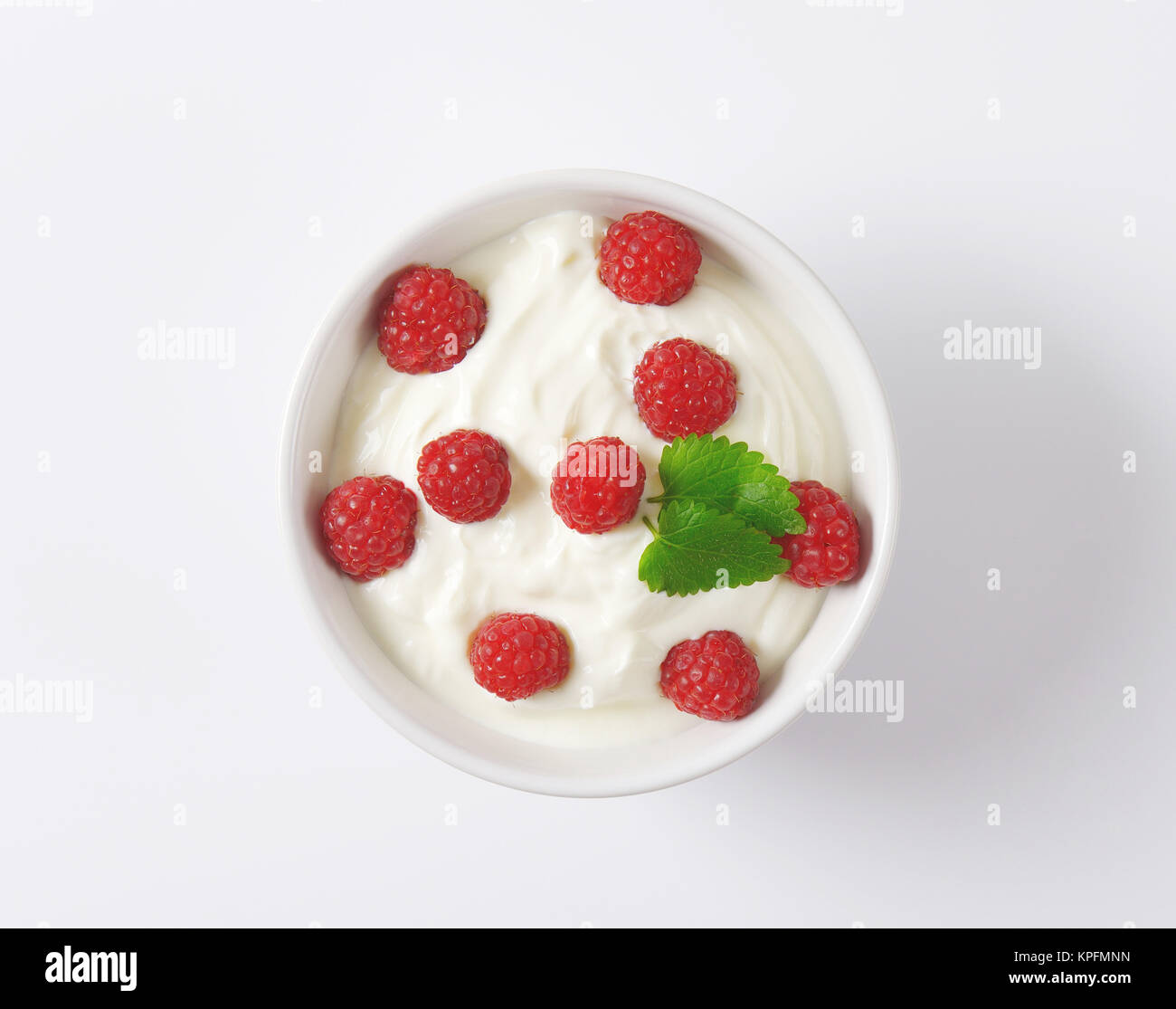raspberries in yoghurt Stock Photo - Alamy