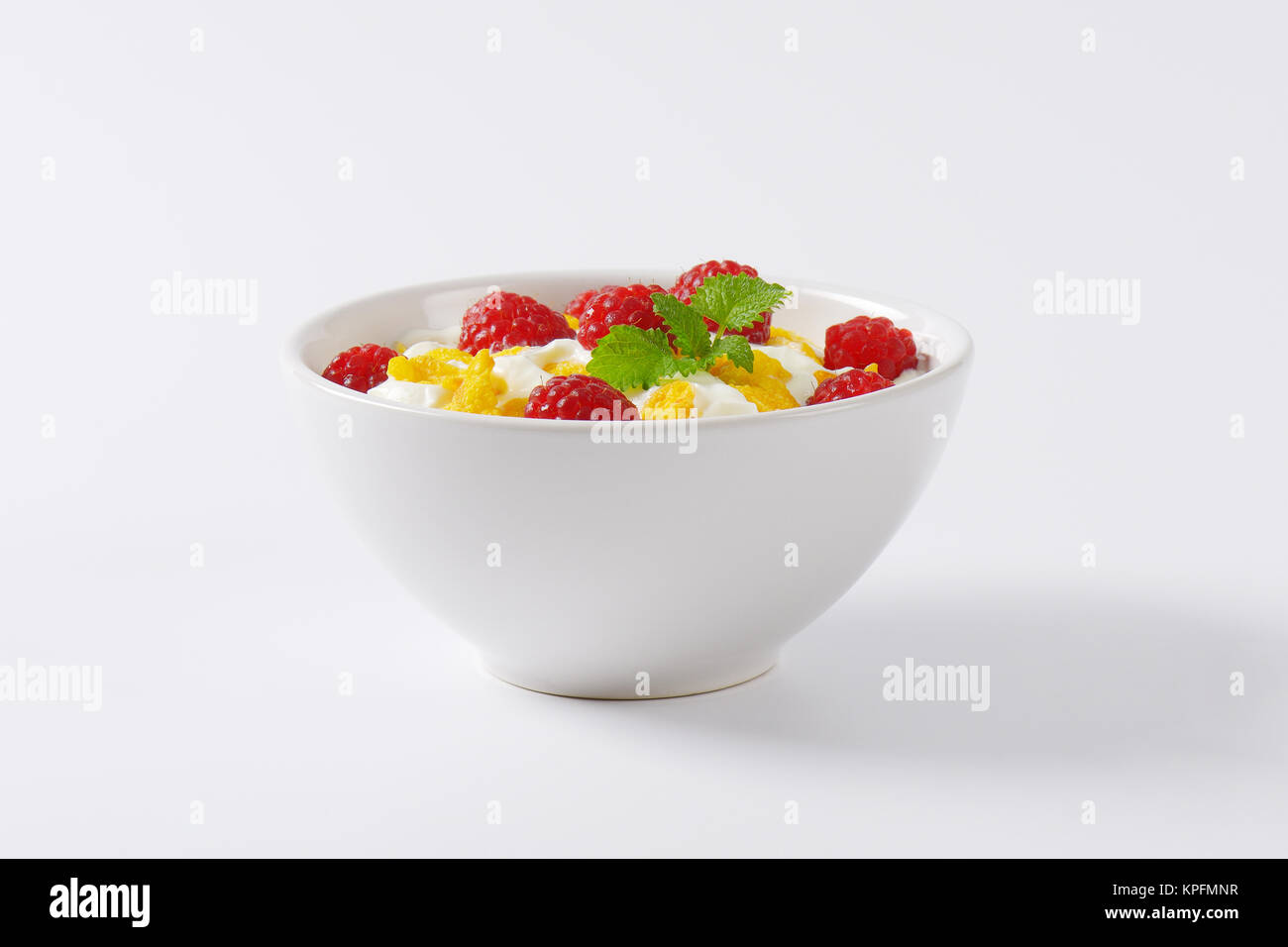 yoghurt with raspberries and cornflakes Stock Photo - Alamy