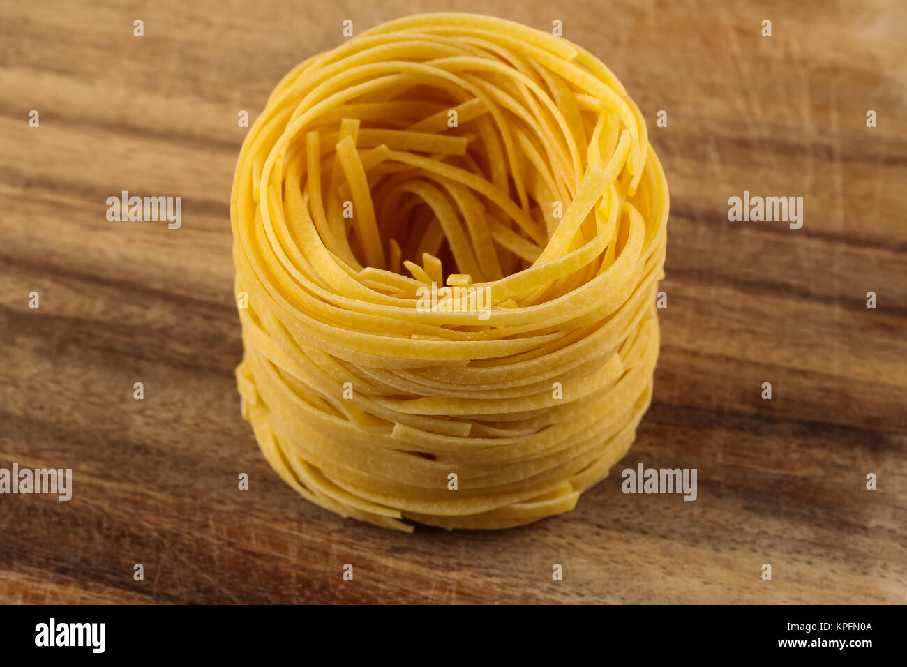 Fettuccine pasta nest Stock Photo - Alamy