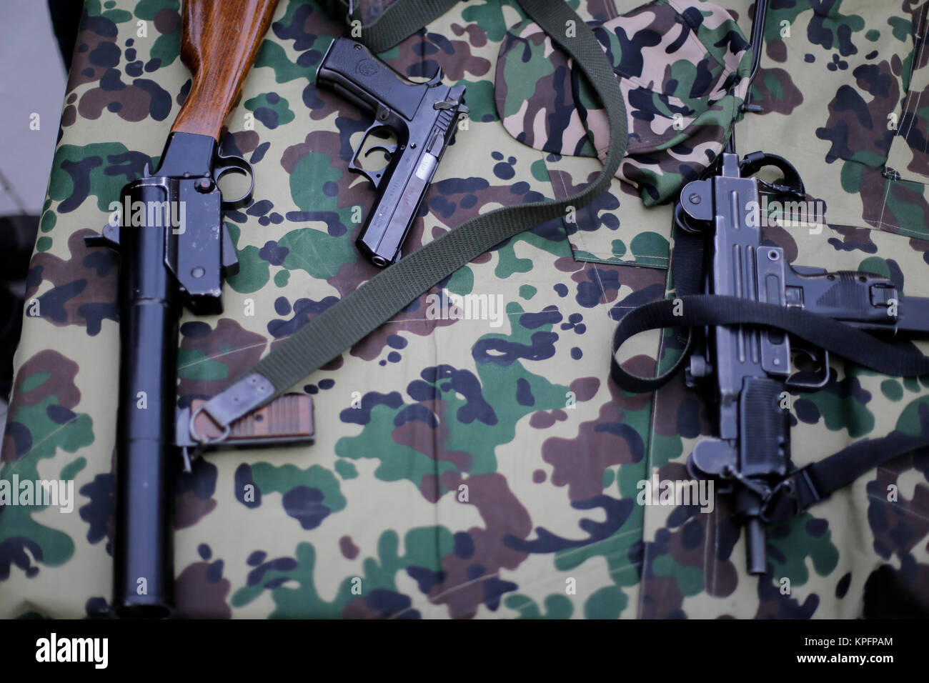 Fire arms on display on a table Stock Photo - Alamy