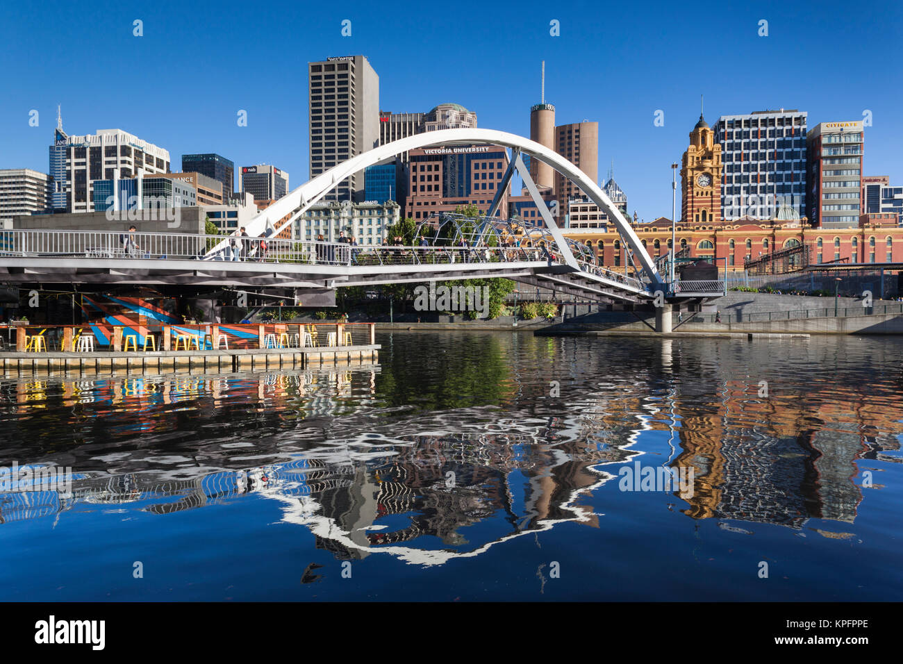 Australia, Victoria, Melbourne, Yarra River footbridge and skyline ...