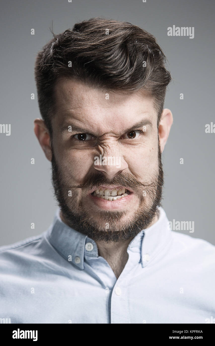 Close up face of angry man Stock Photo - Alamy