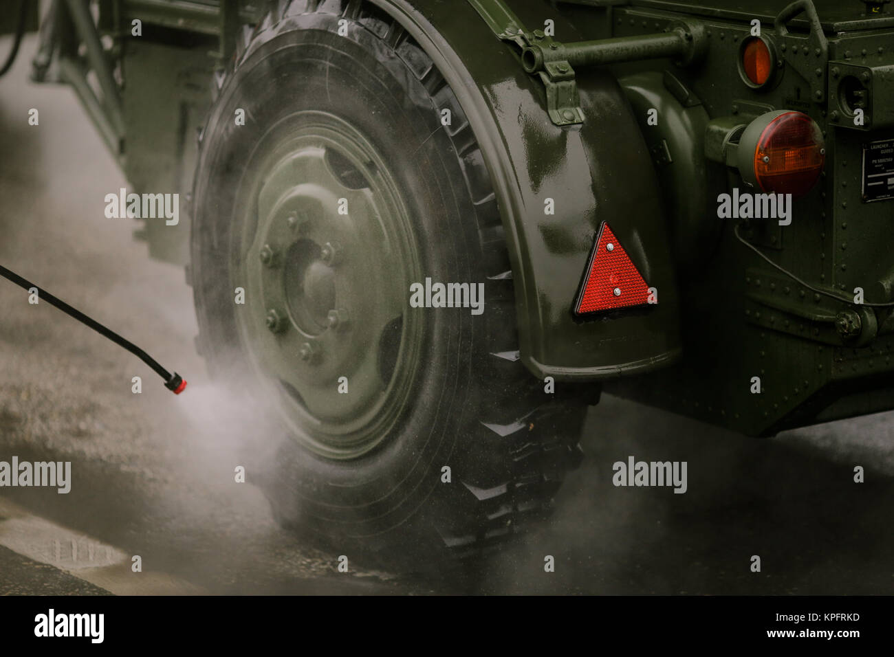 Soldier washing an armoured vehicle at a military parade Stock Photo ...
