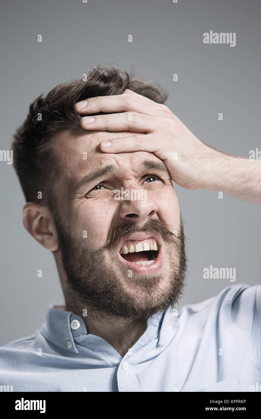 Close up face of desperate man Stock Photo - Alamy