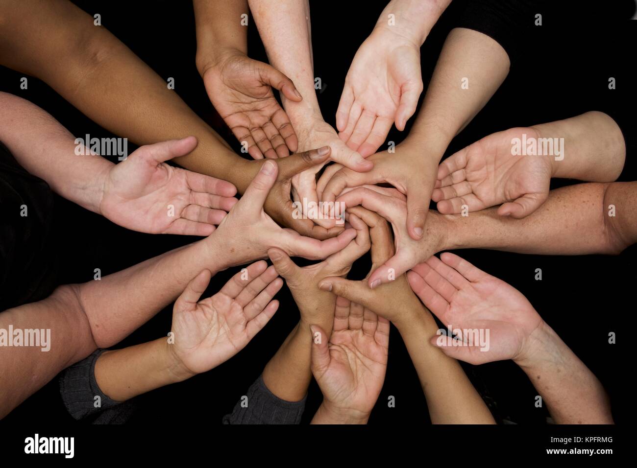 hands of many colors unite in harmonious diversity and heart felt team ...