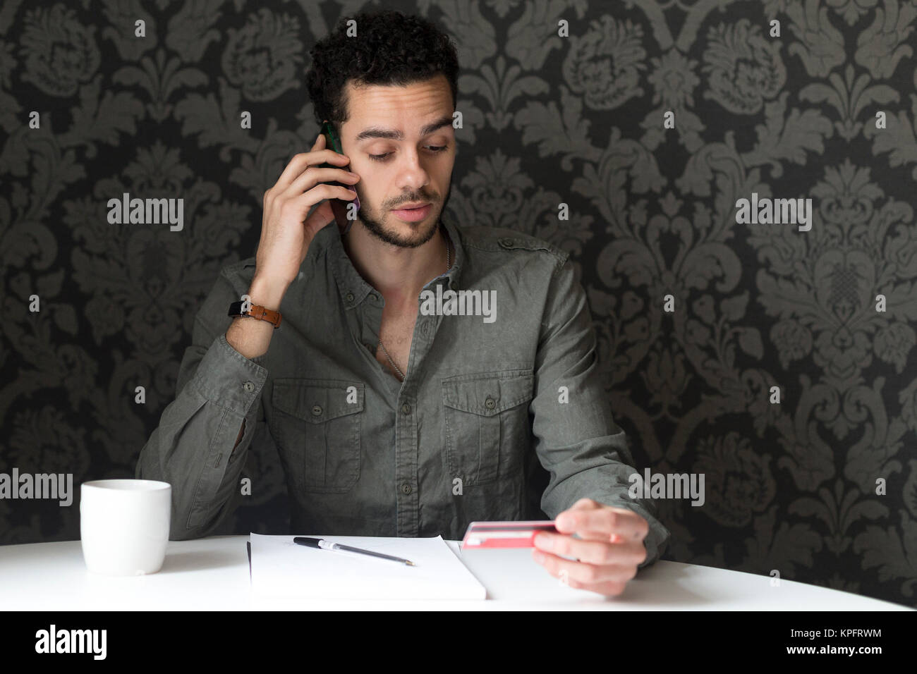 Making a phone payment Stock Photo - Alamy