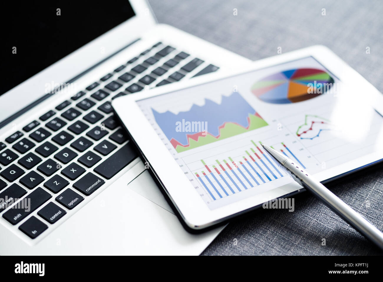 Digital tablet showing charts Stock Photo - Alamy