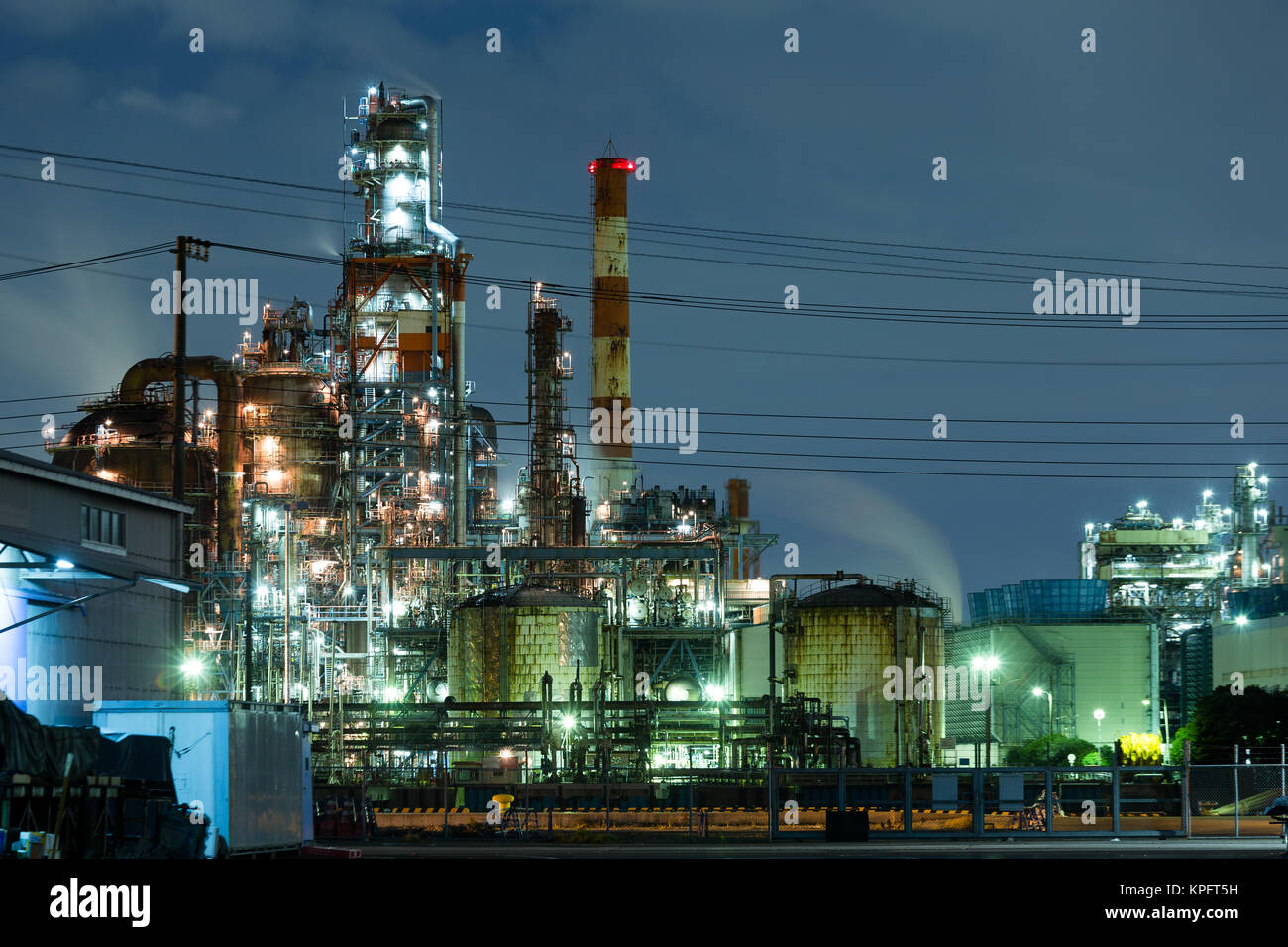 Industrial factory plant working at night Stock Photo - Alamy