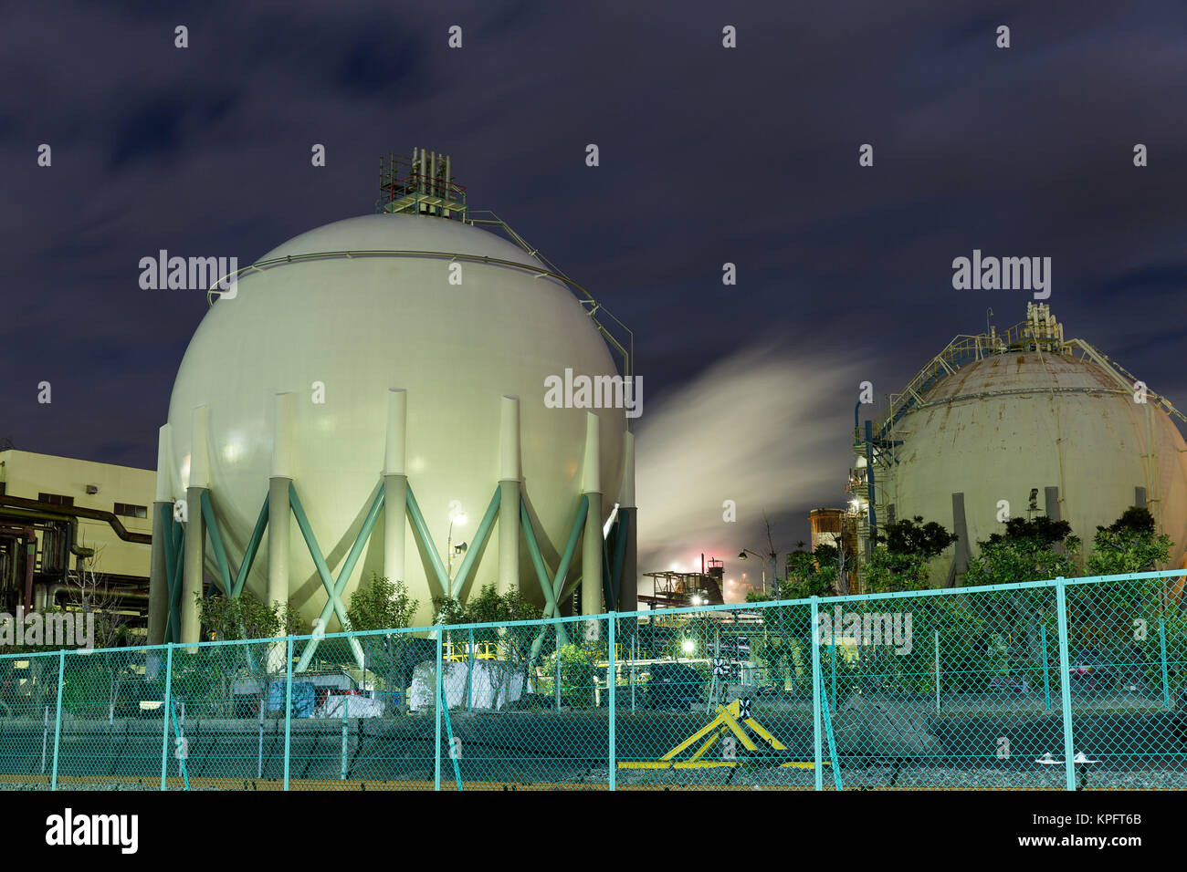 Natural Gas storage tanks at night Stock Photo - Alamy