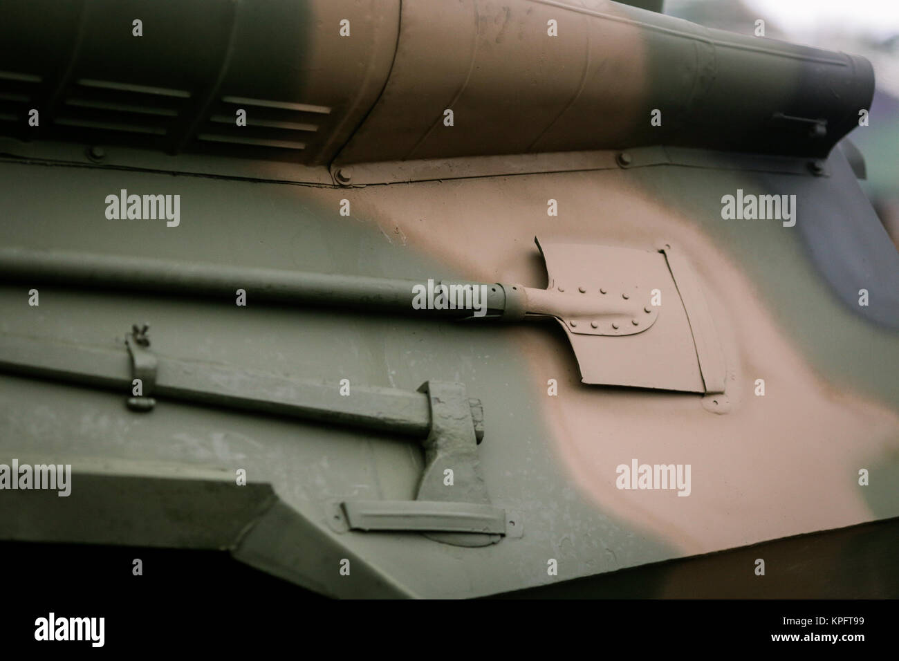 Military shovel and axe on an armoured vehicle Stock Photo - Alamy