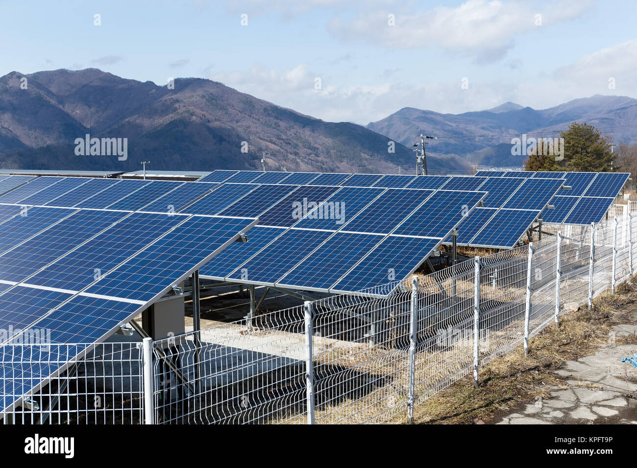 Solar panel with mountain range background Stock Photo - Alamy
