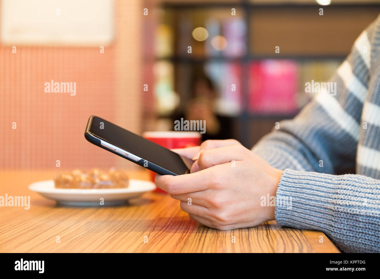 Woman typing on mobile phone Stock Photo - Alamy