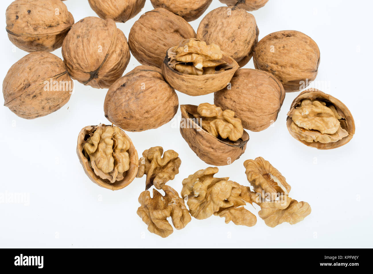 walnut and a cracked walnut isolated on the white background Stock ...