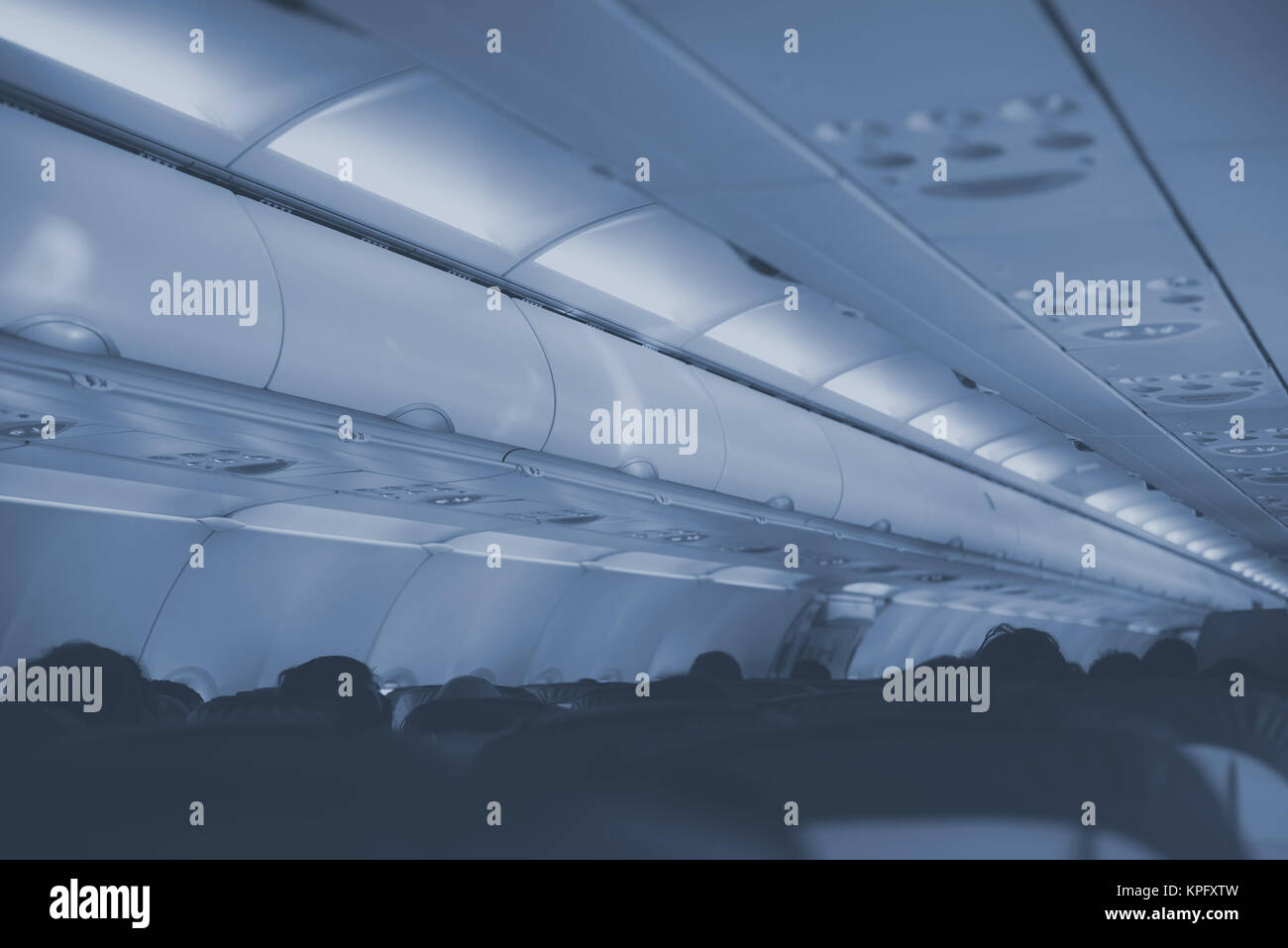 Interior inside of the plane with passengers Stock Photo - Alamy