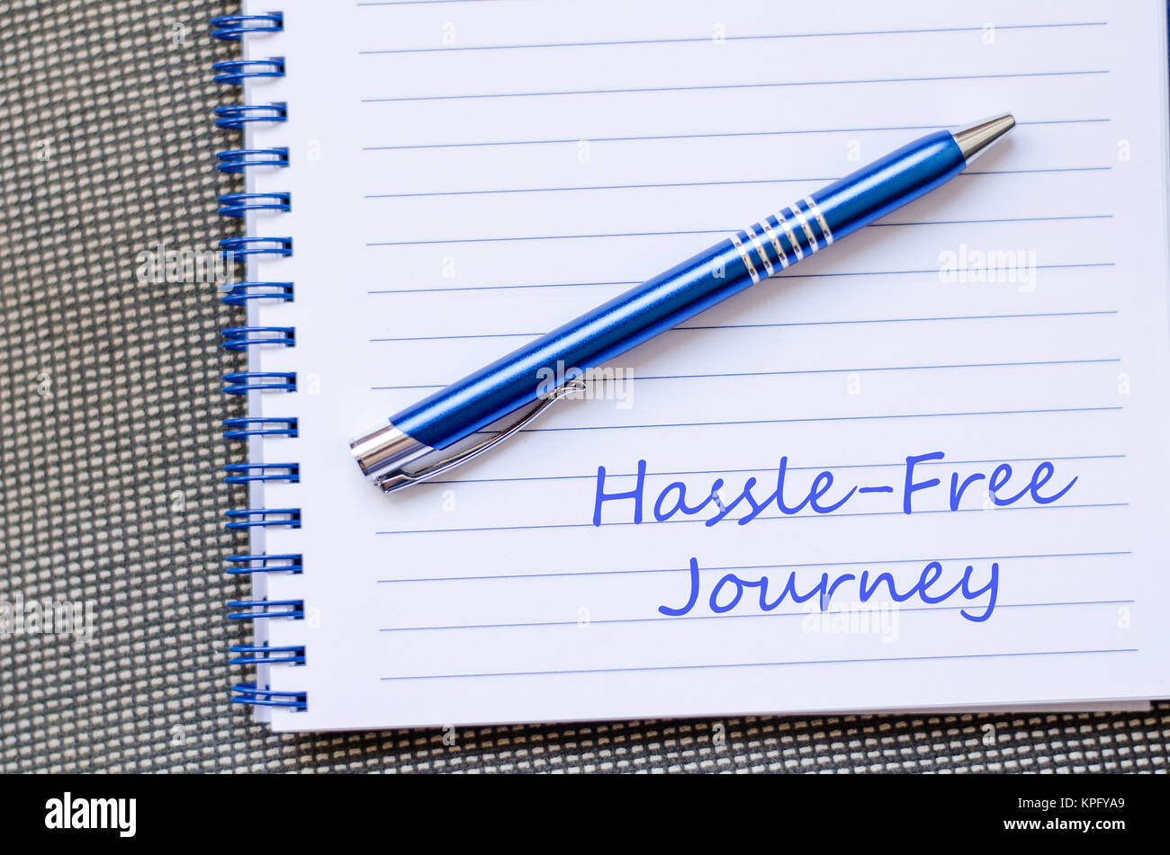 Hassle free journey write on notebook Stock Photo - Alamy