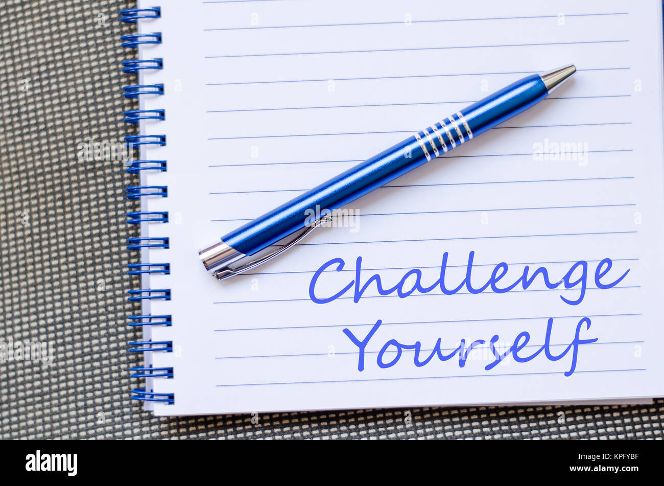 Challenge yourself write on notebook Stock Photo - Alamy