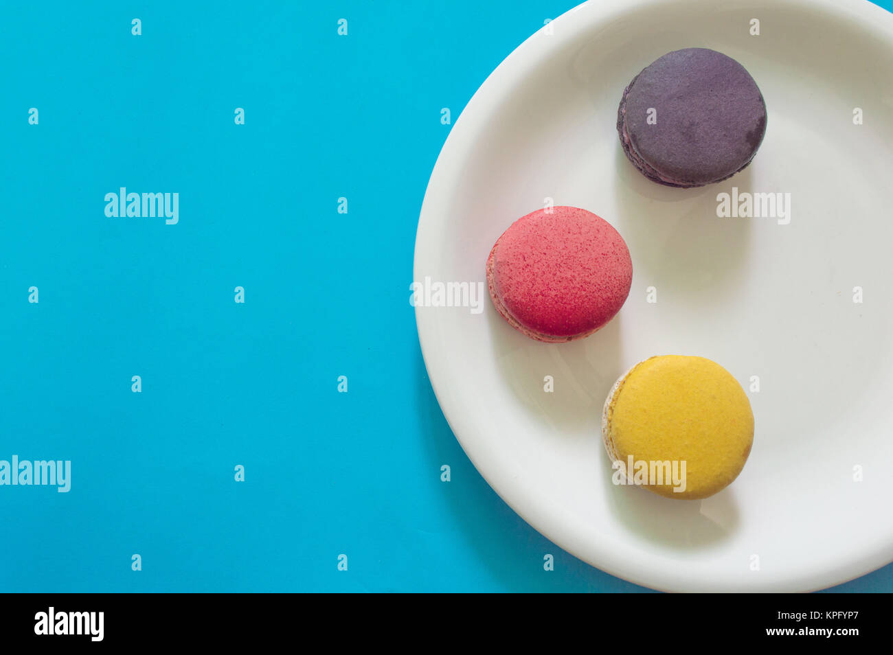colorful macaron on white plate Stock Photo - Alamy