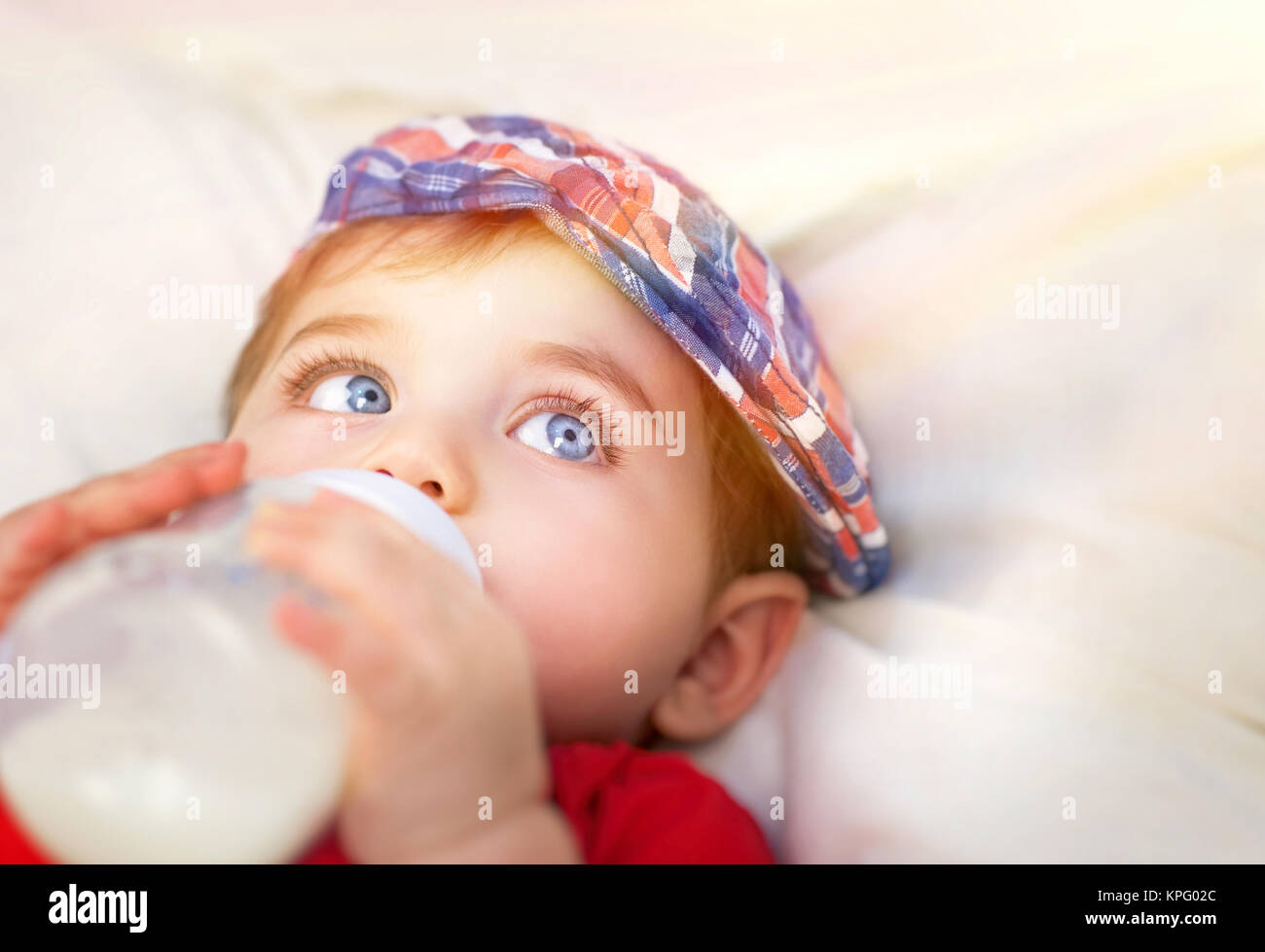 Cute little baby eating Stock Photo - Alamy