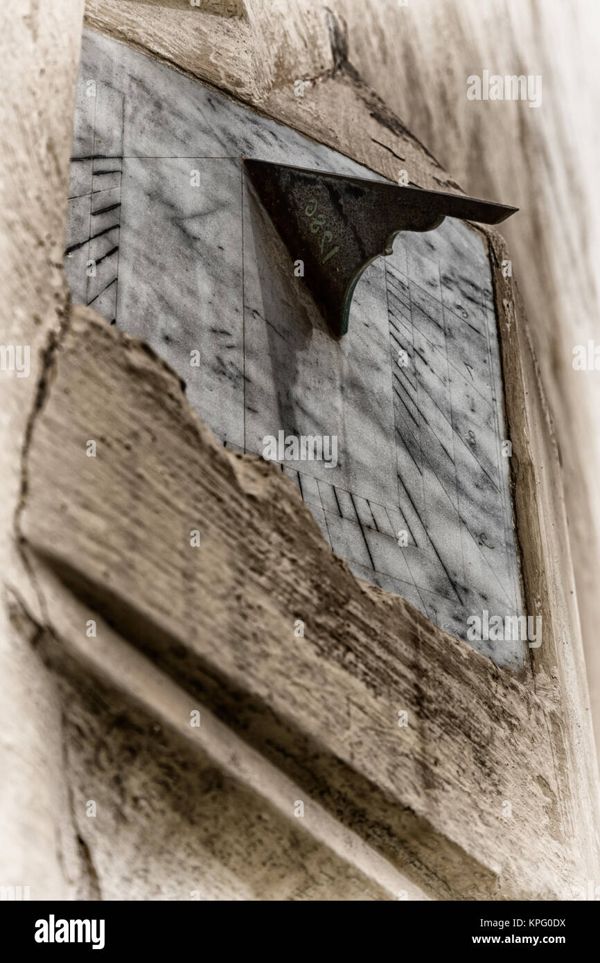 and the gnomon in the antique broken wall Stock Photo - Alamy