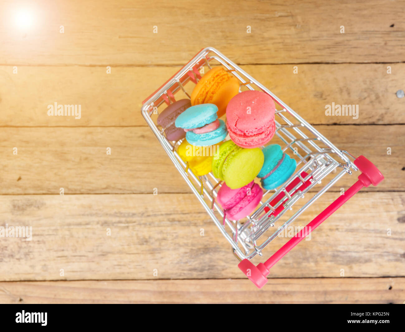 Macaroon in shopping cart Stock Photo - Alamy