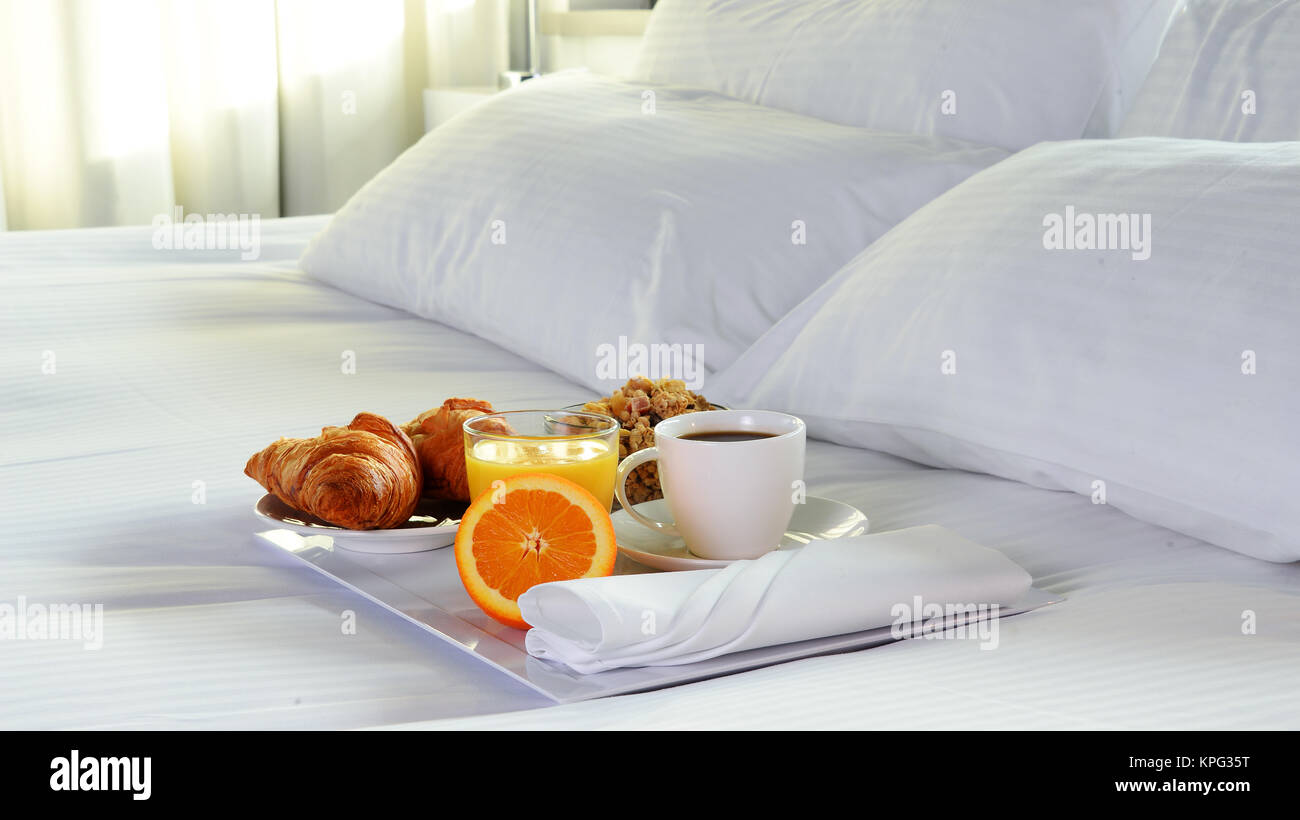 Breakfast in bed in hotel room Stock Photo - Alamy
