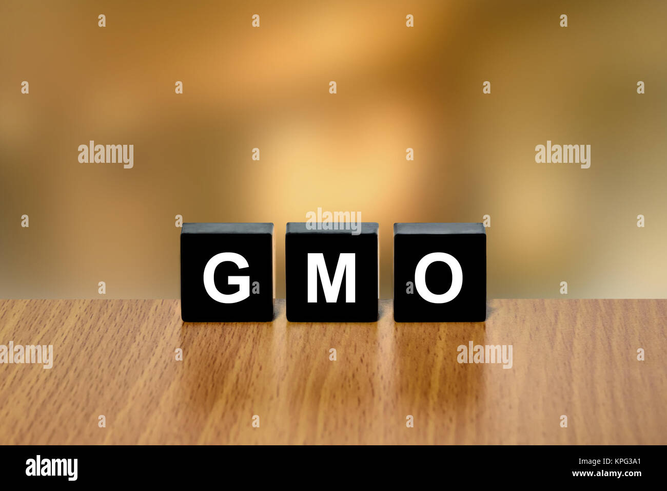 GMO or Genetically Modified Organism on black block Stock Photo - Alamy