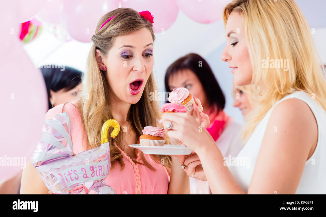 woman handing pregnant girlfriend a present Stock Photo - Alamy