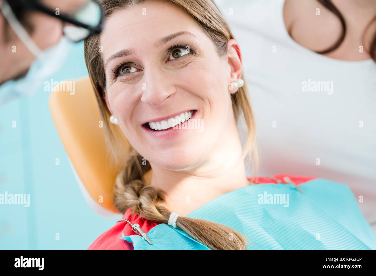 woman at the dentist with dental assistant smiling Stock Photo - Alamy