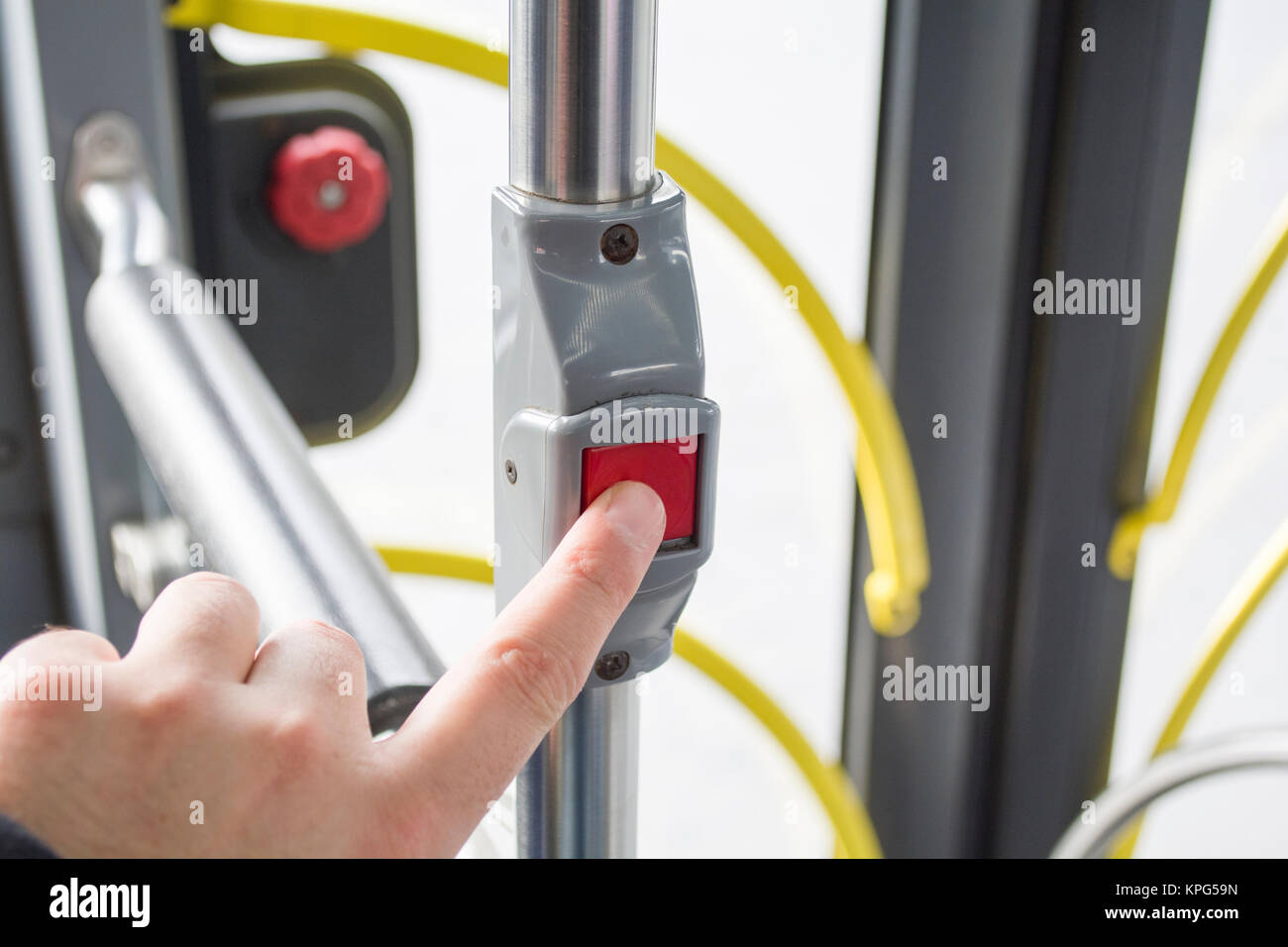 man pressing button on bus Stock Photo - Alamy