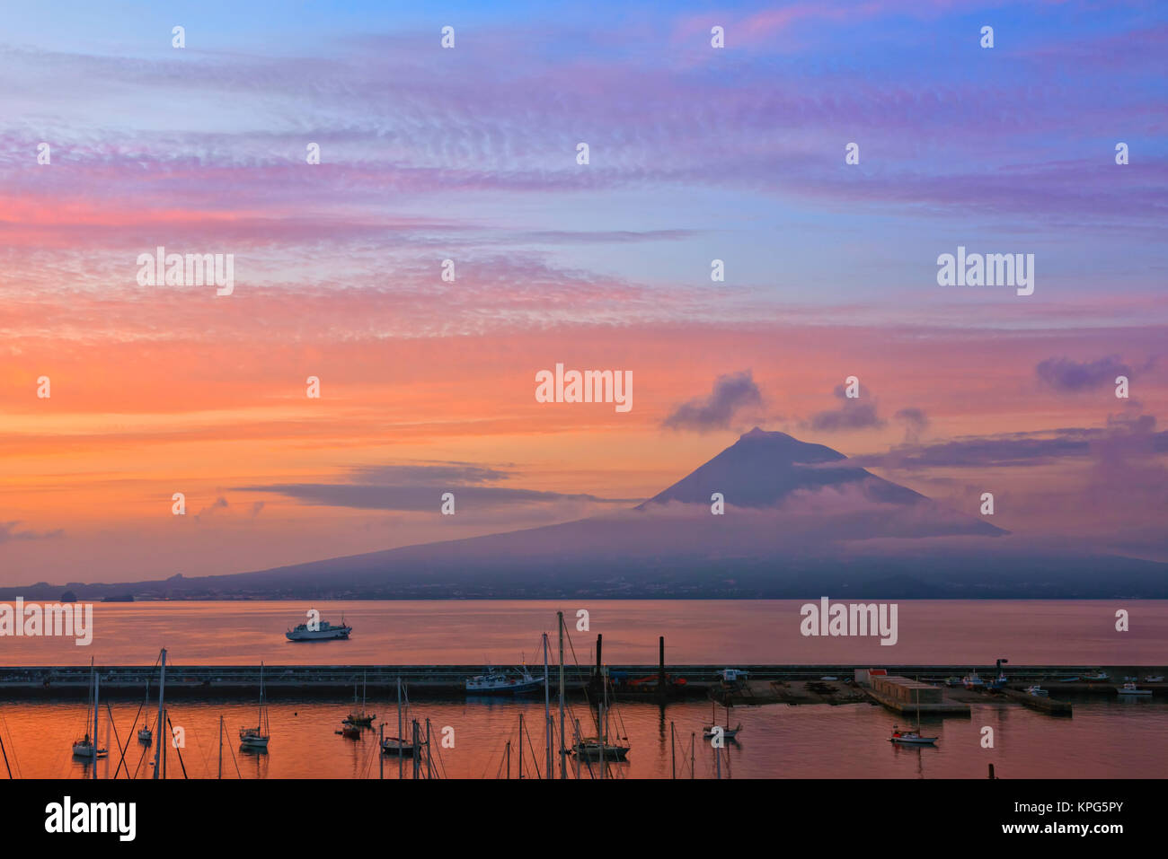 View of Mount Pico from the island of Faial at sunrise Stock Photo - Alamy