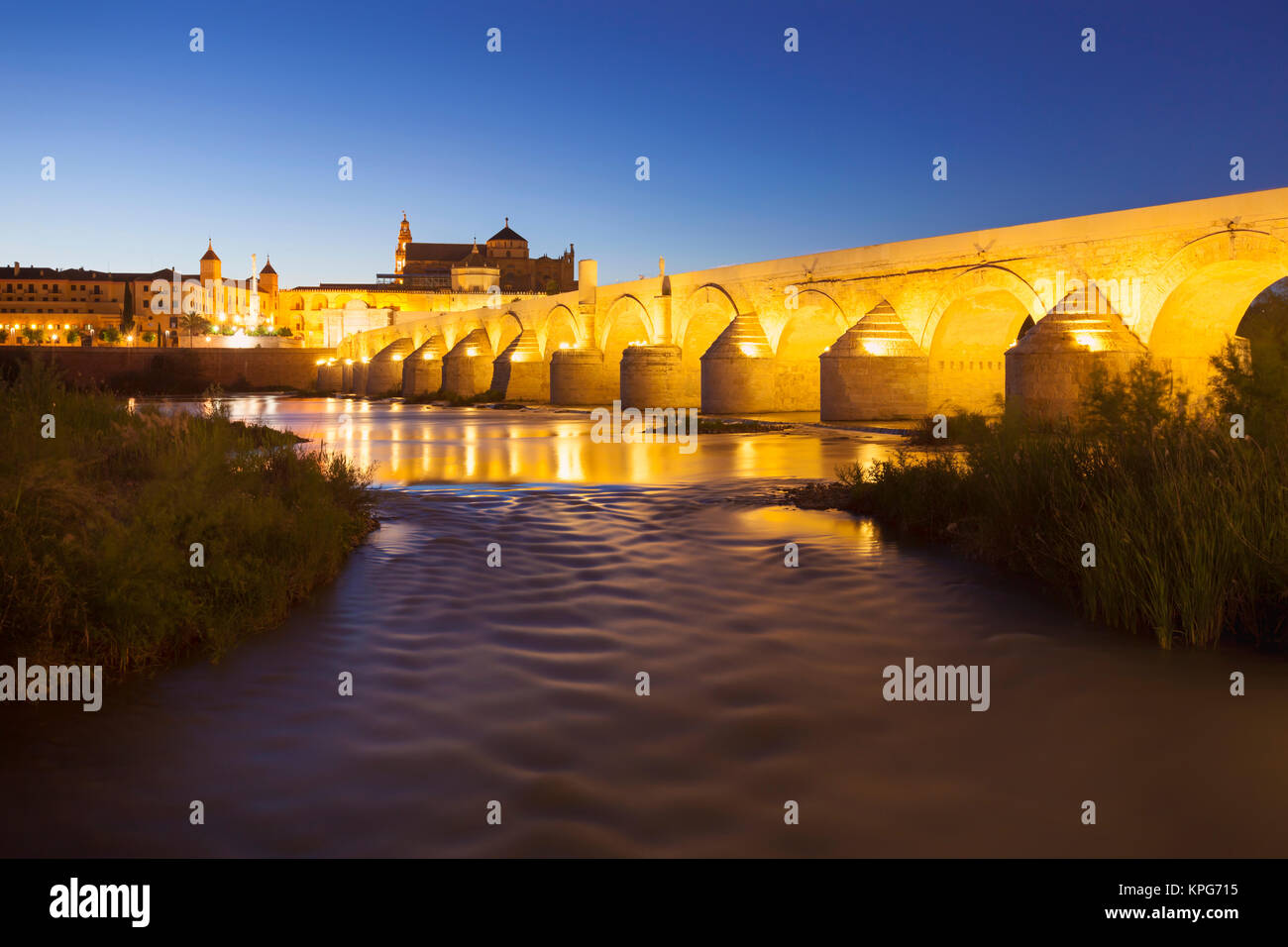 Famous Roman Bridge at Cordoba, Spain, at dusk Stock Photo - Alamy