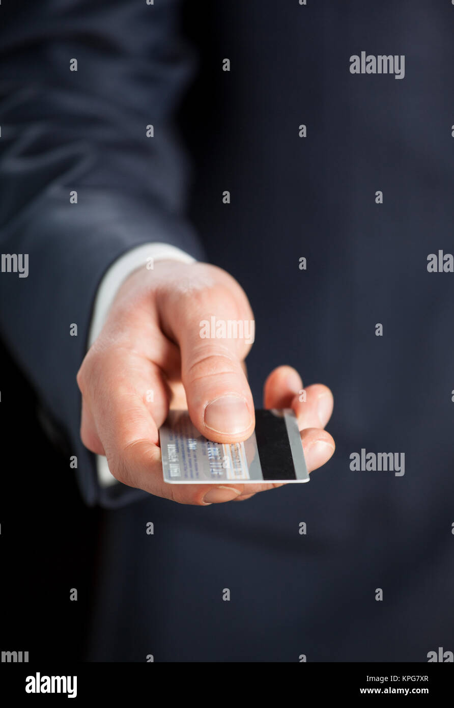 Businessman giving credit card Stock Photo - Alamy