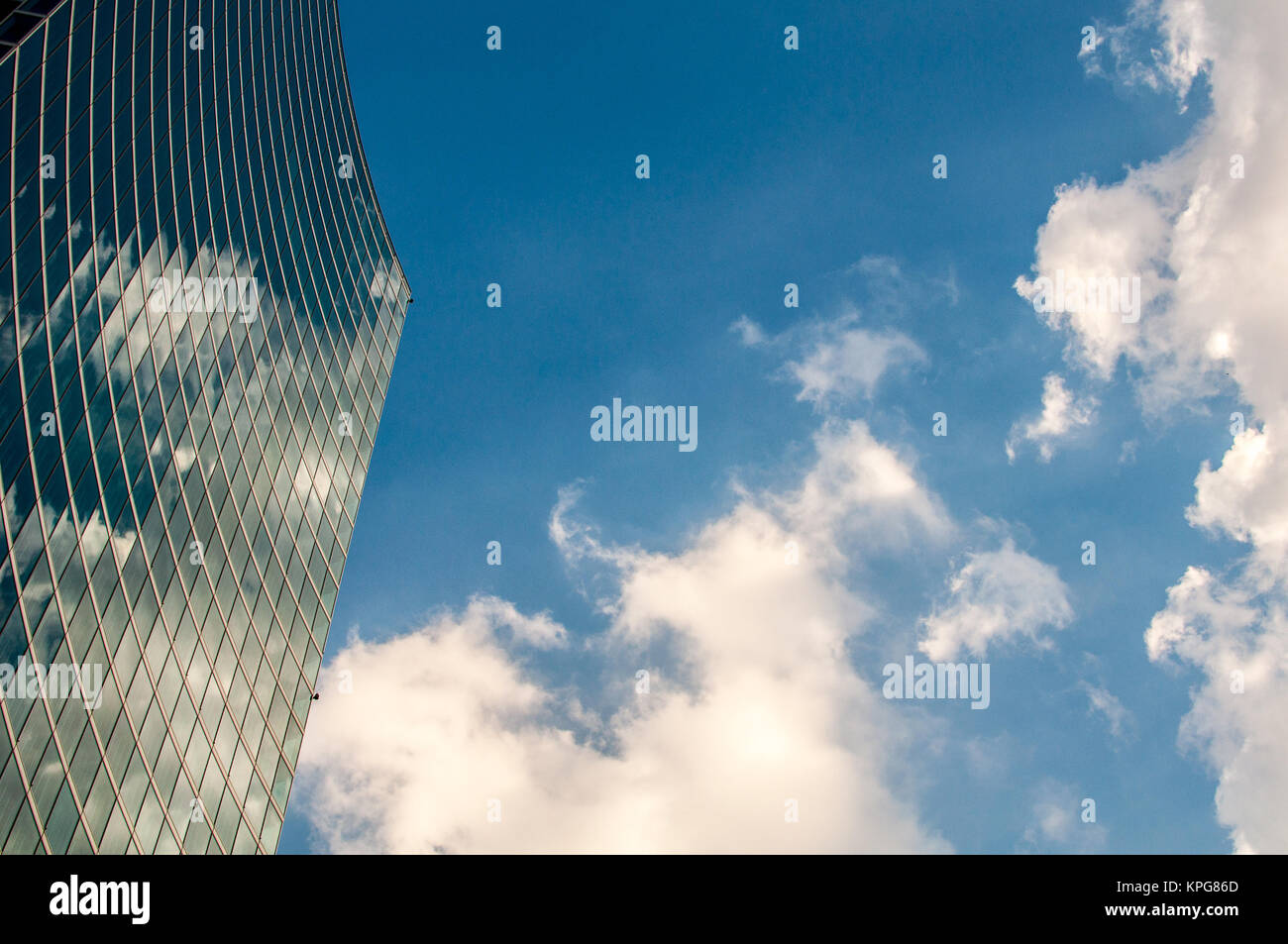 Reflections of clouds on glass facade of modern building hi-res stock ...