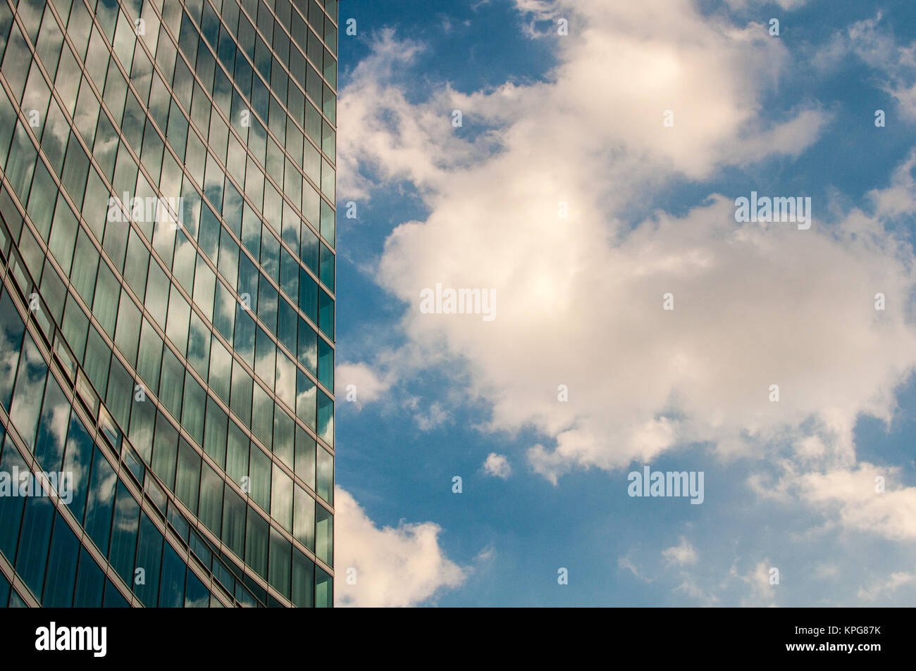 Modern skyscraper with reflections of clouds on windows, details Stock ...