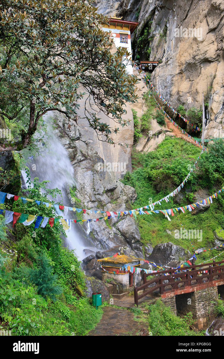 Asia, Bhutan. Taksang Dzong monastery is built into the rock and hangs ...