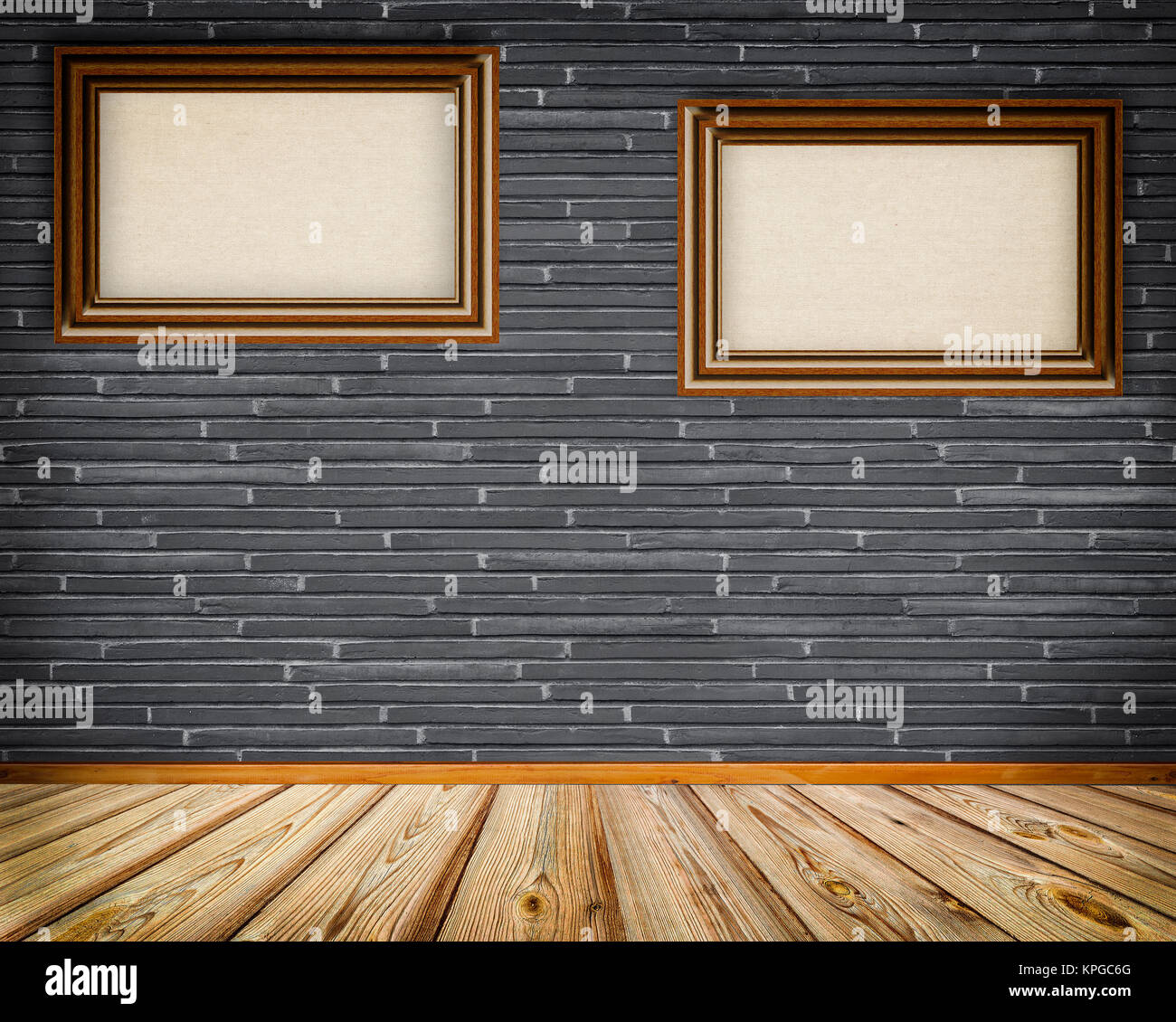 Two frame on brick wall and wooden floor Stock Photo - Alamy