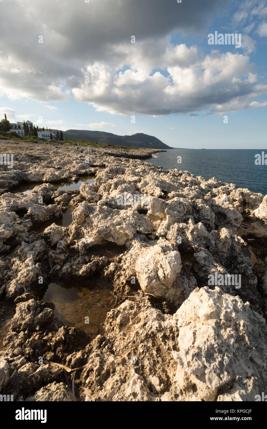 Limestone scenery with rock pools next to the sea near Latchi in Cyprus ...