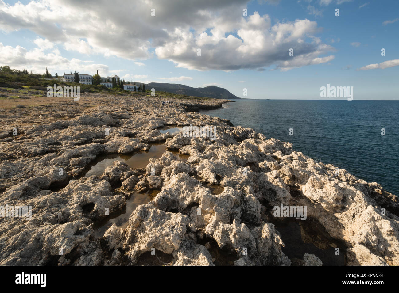 Limestone scenery with rock pools next to the sea near Latchi in Cyprus ...