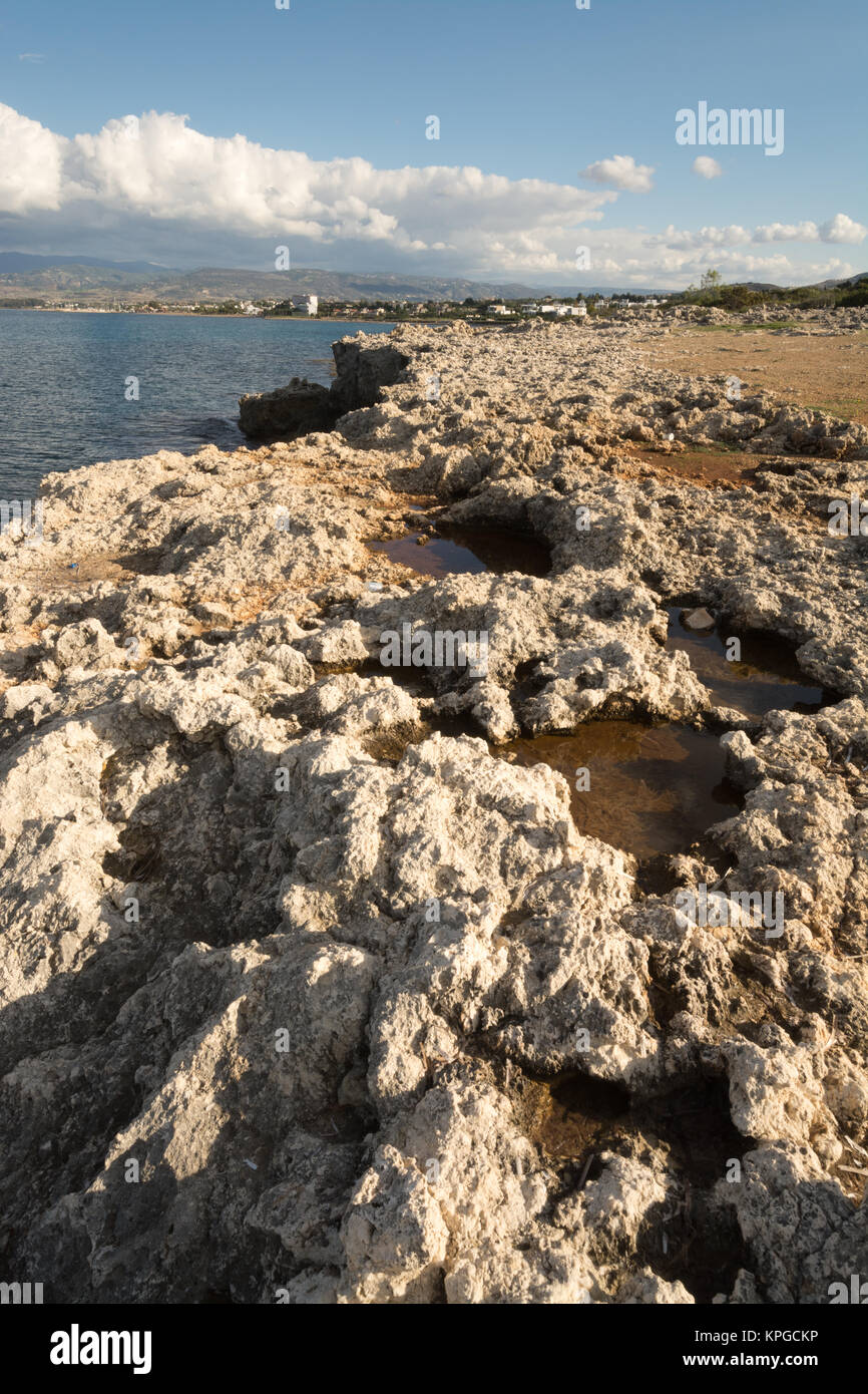 Limestone scenery with rock pools next to the sea near Latchi in Cyprus ...