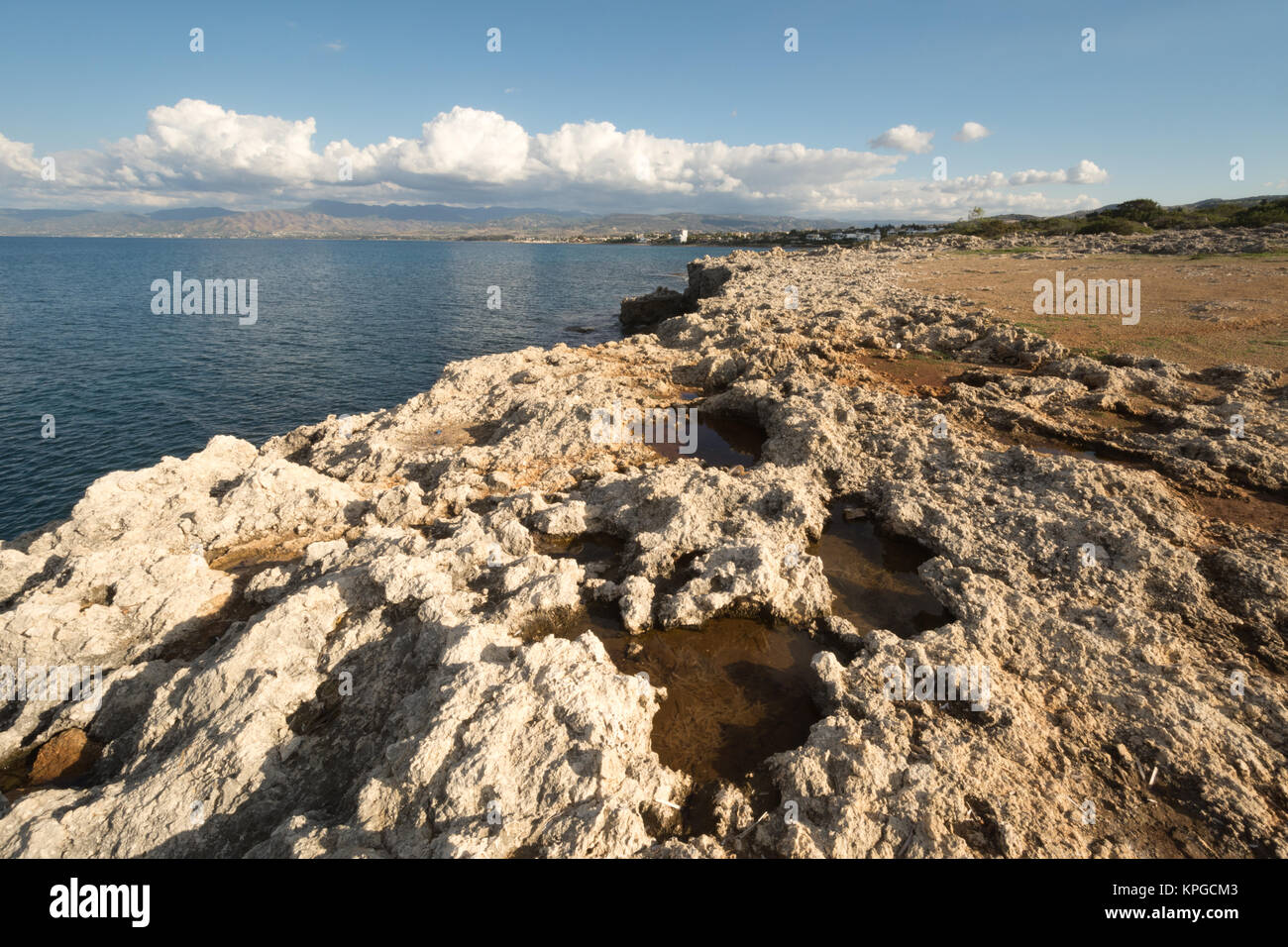 Limestone scenery with rock pools next to the sea near Latchi in Cyprus ...