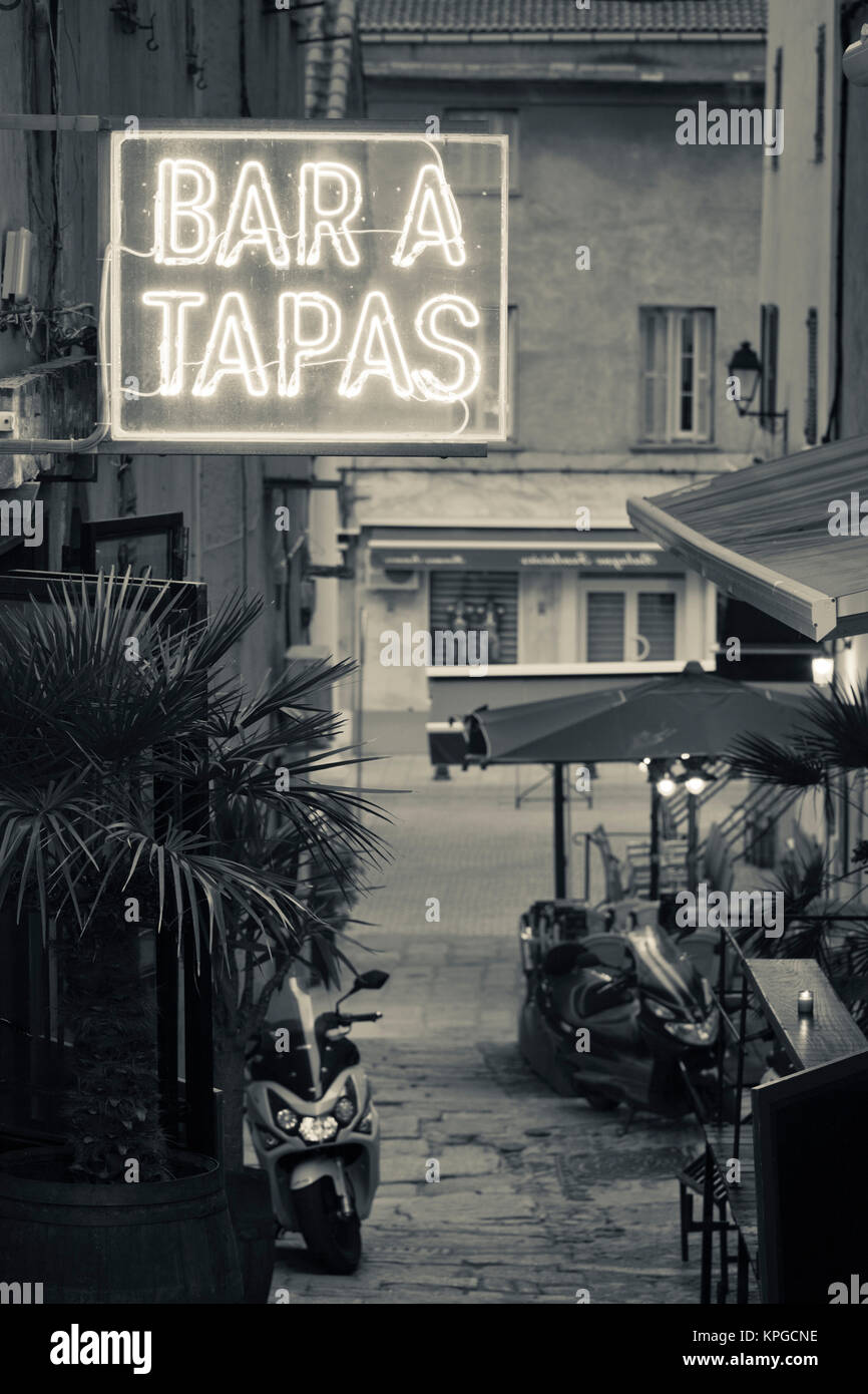 France, Corsica, La Balagne, Ile Rousse, neon sign for tapas bar, dusk ...