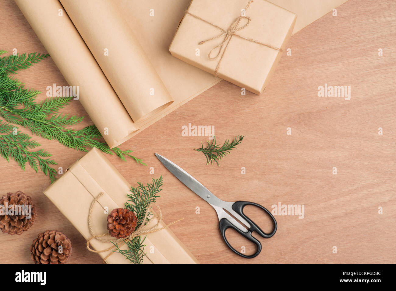 Hand crafted Christmas present gifts box and tools on wooden background ...