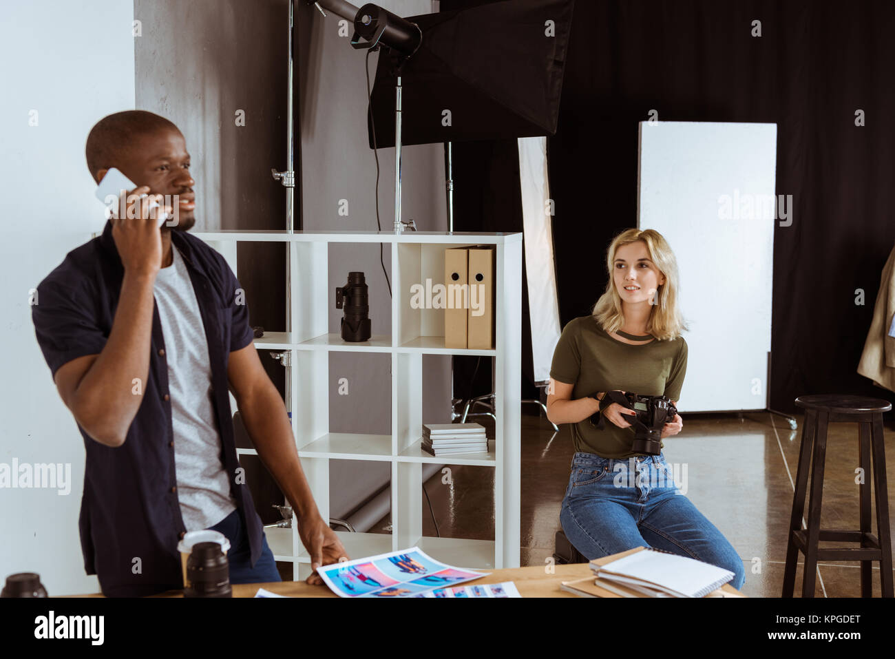 afican american photographer talking on smartphone while Stock Photo ...