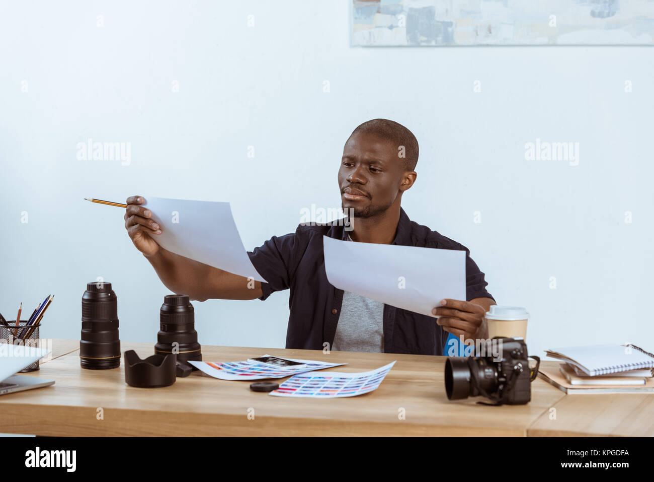portrait of focused african american photographer looking Stock Photo ...