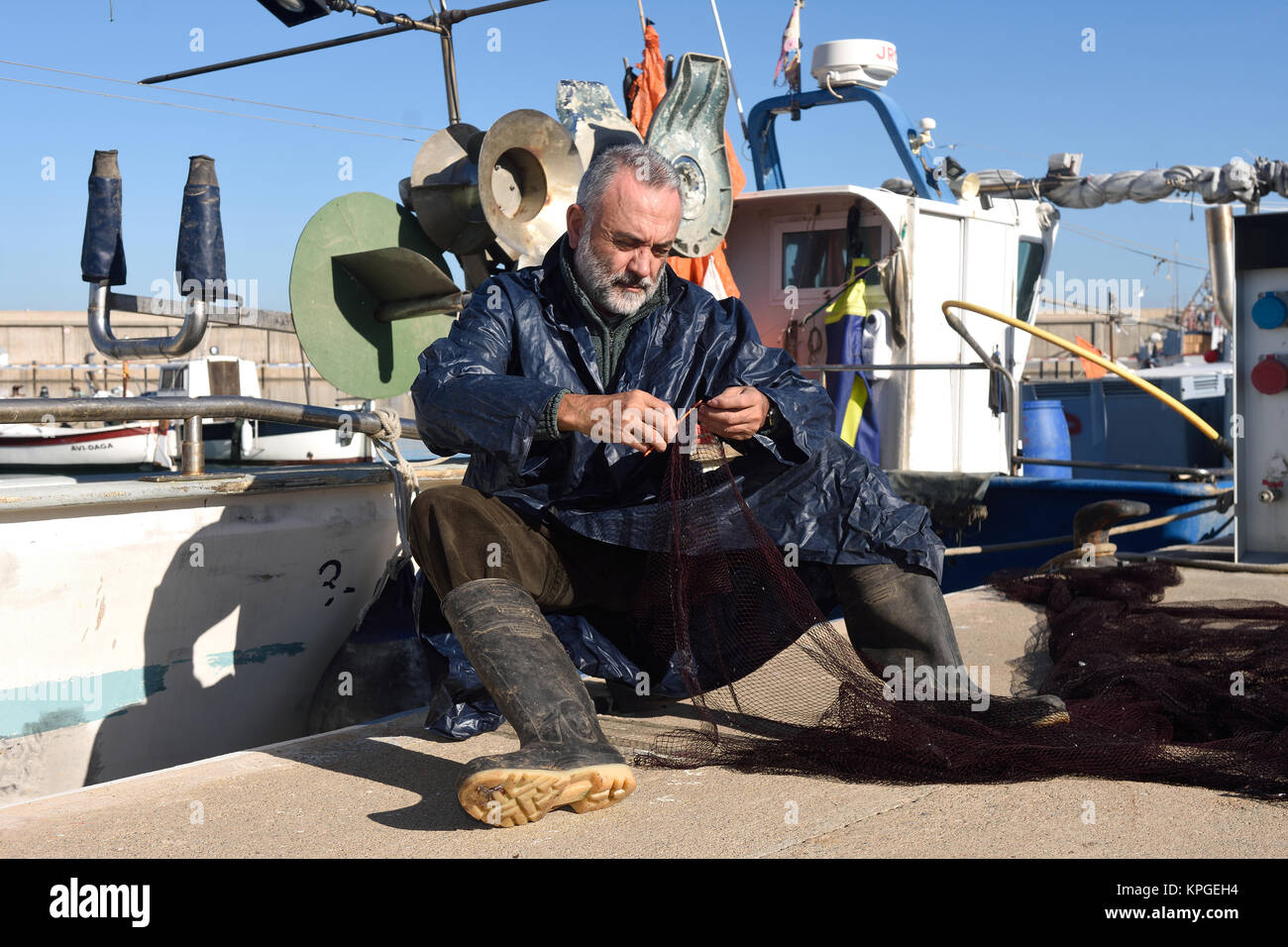 fisherman working in the sea Stock Photo - Alamy